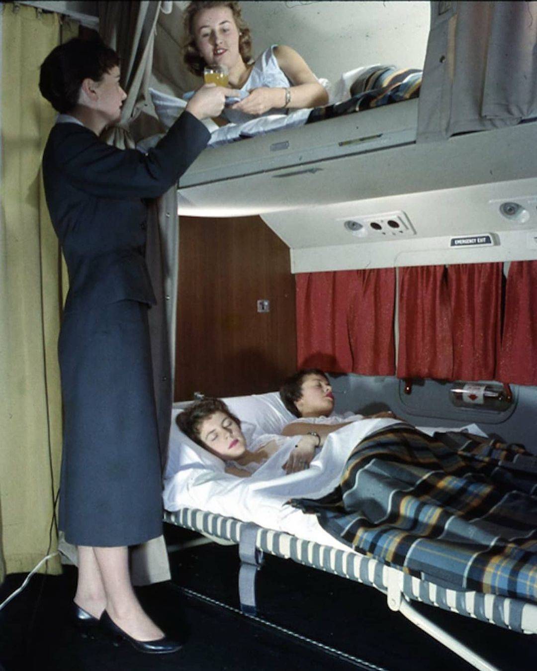 Bunk beds on a plane, 1960s. | Scrolller