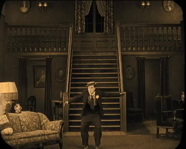 Buster Keaton running from a ghost in The Haunted House (1921) | Scrolller