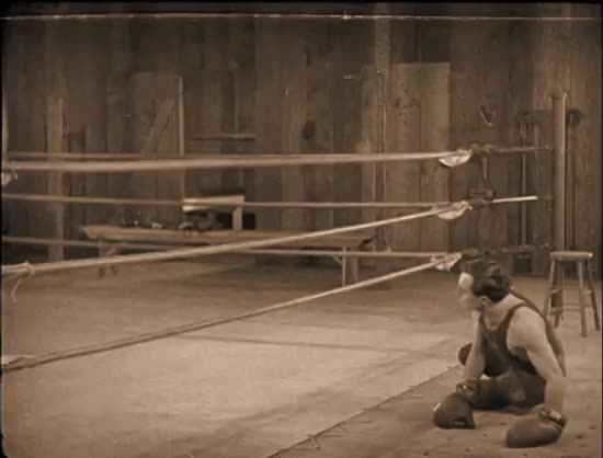 Buster Keaton trying to get into a boxing ring in Battling Butler (1926) | Scrolller