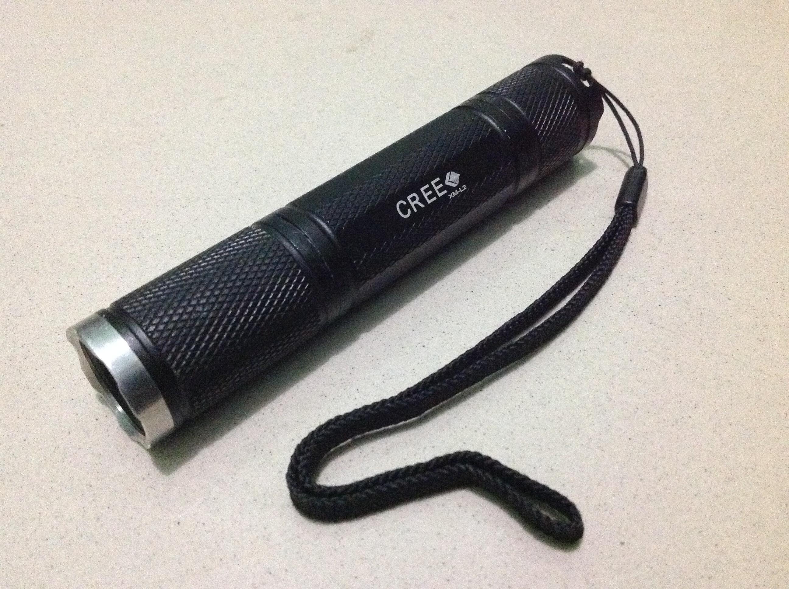 Can anyone help me to identify this flashlight? It was a special gift I received and I just lost ...