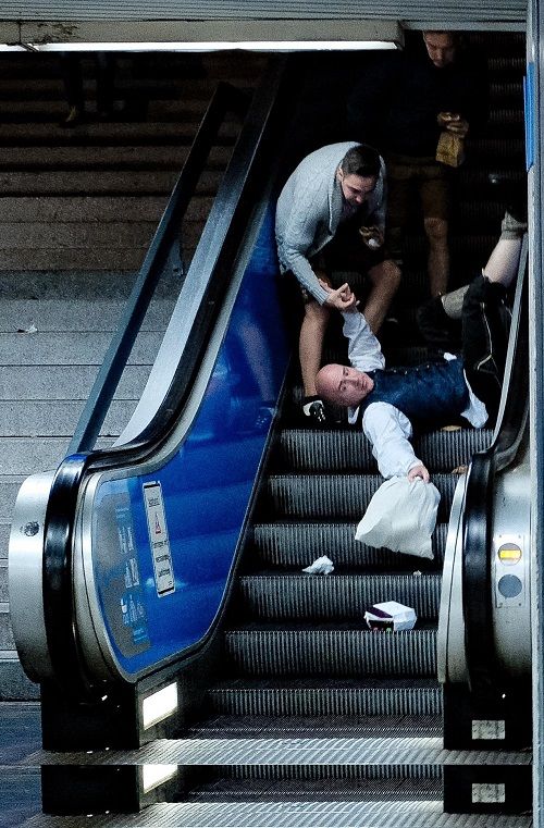 Caption this escalator scene | Scrolller