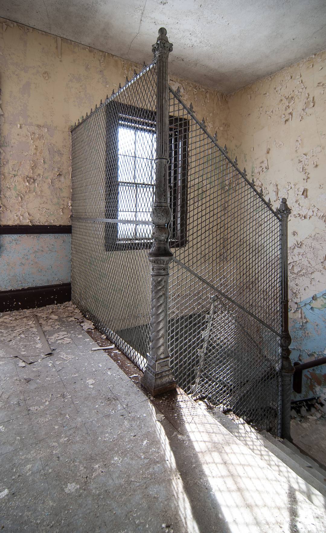 Cast iron suicide prevention fencing on asylum stairs...definition of crazy stairs | Scrolller