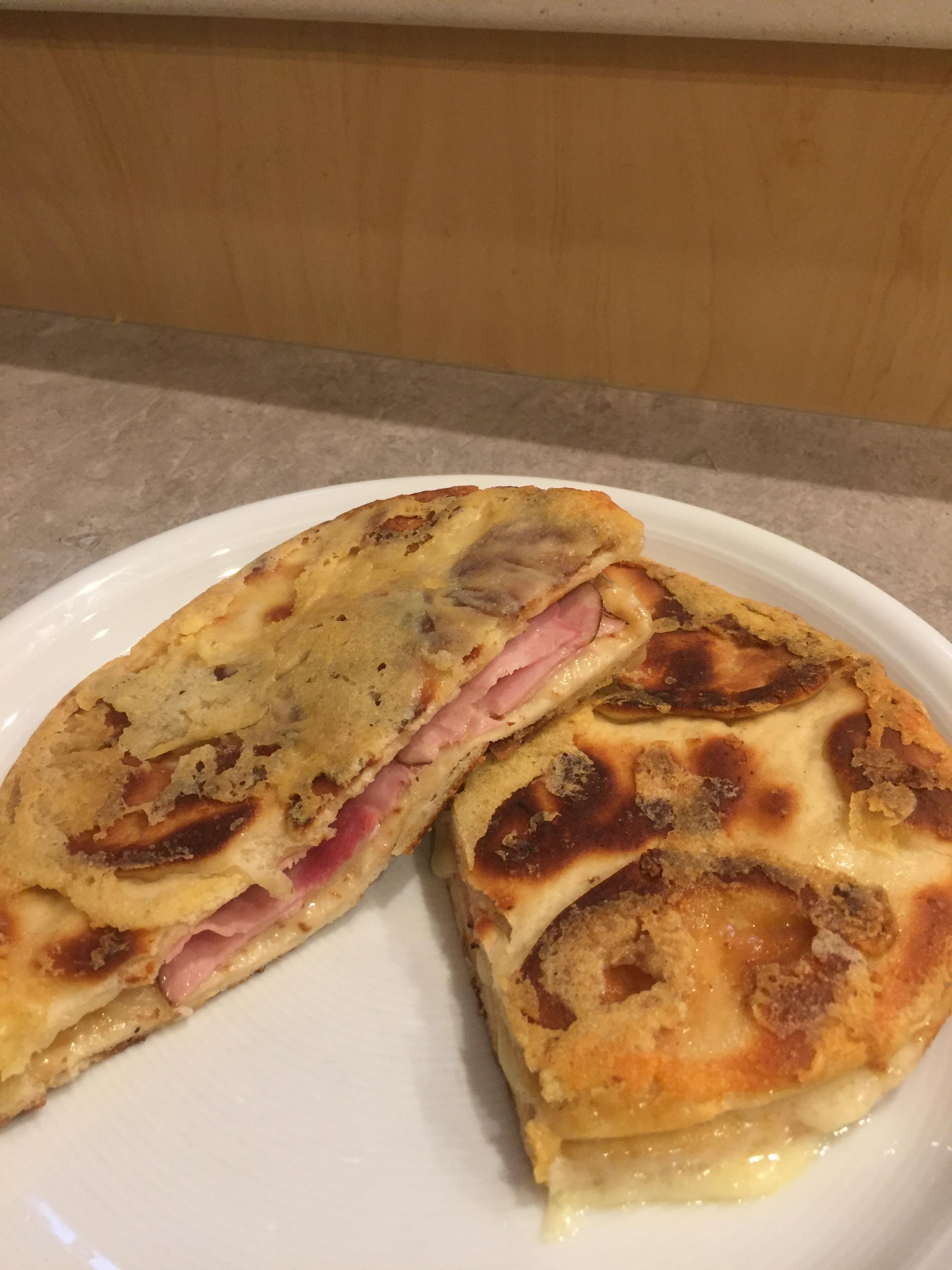 Cheddar cheese and ham on naan bread with fried cheese coating | Scrolller