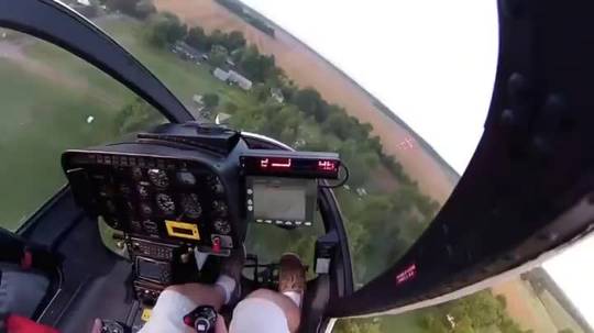 Cockpit view of a helicopter crop dusting in Kentucky | Scrolller