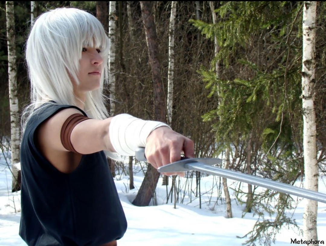 Cute cosplayer with sword | Scrolller