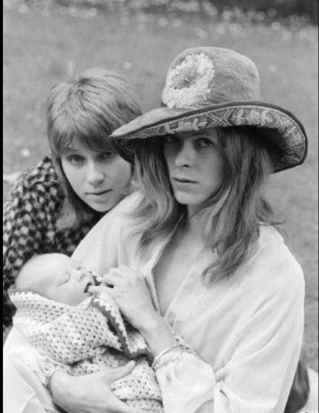 David Bowie holding Duncan (circa 1971) | Scrolller
