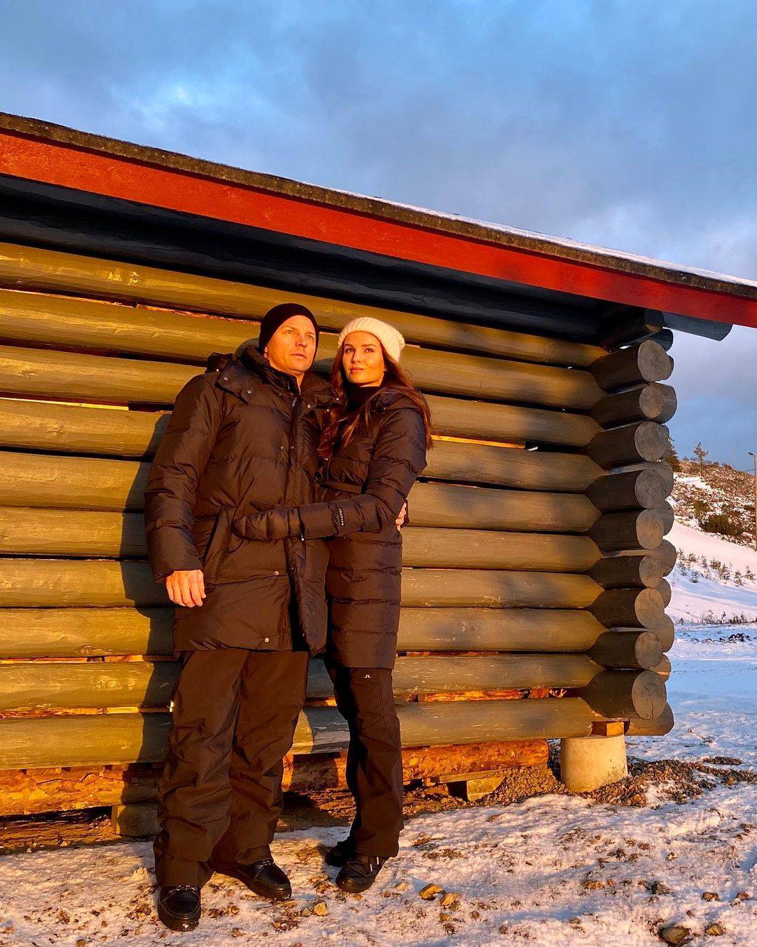 Day 4771 of Kimi’s reign as Ferrari Champion. Here he is by a log cabin, with his wife. | Scrolller