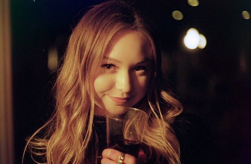 Dimly lit Taylor with Drink | Scrolller