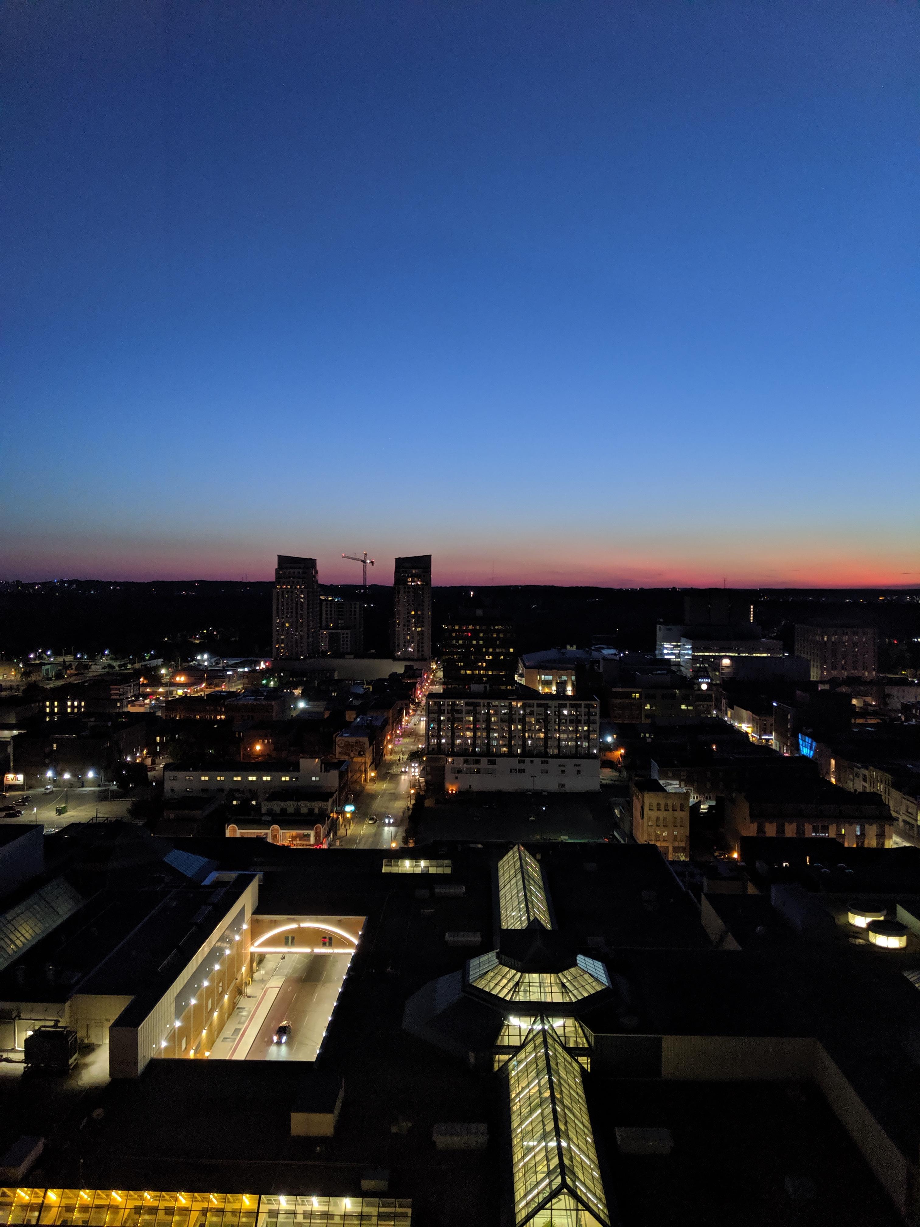 Downtown lights with the sun setting | Scrolller