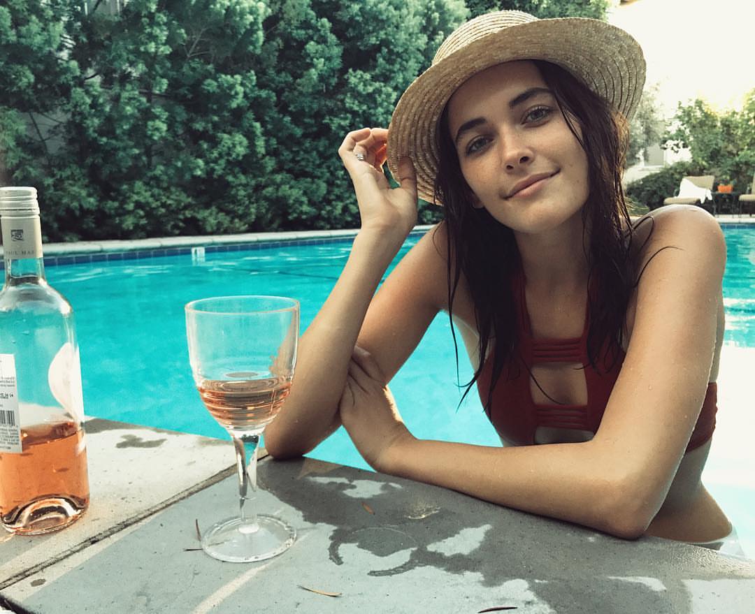 Drinking wine at the pool | Scrolller