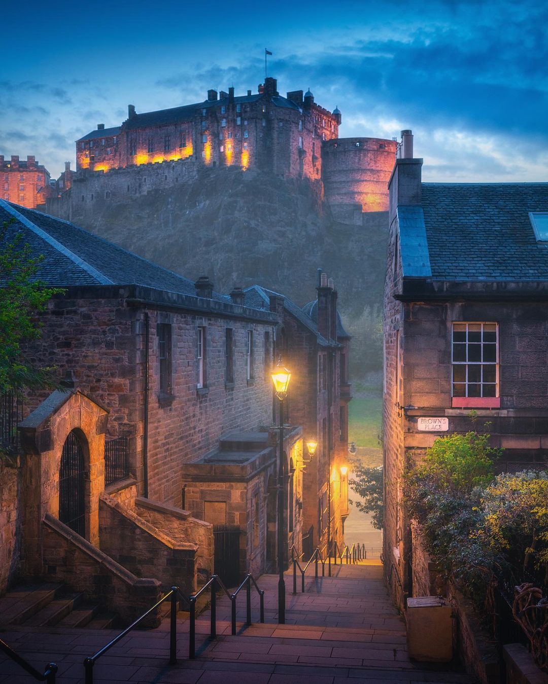Edinburgh Castle and its Half Moon Battery seen from the vennel steps in the Old Town, Edinburgh ...