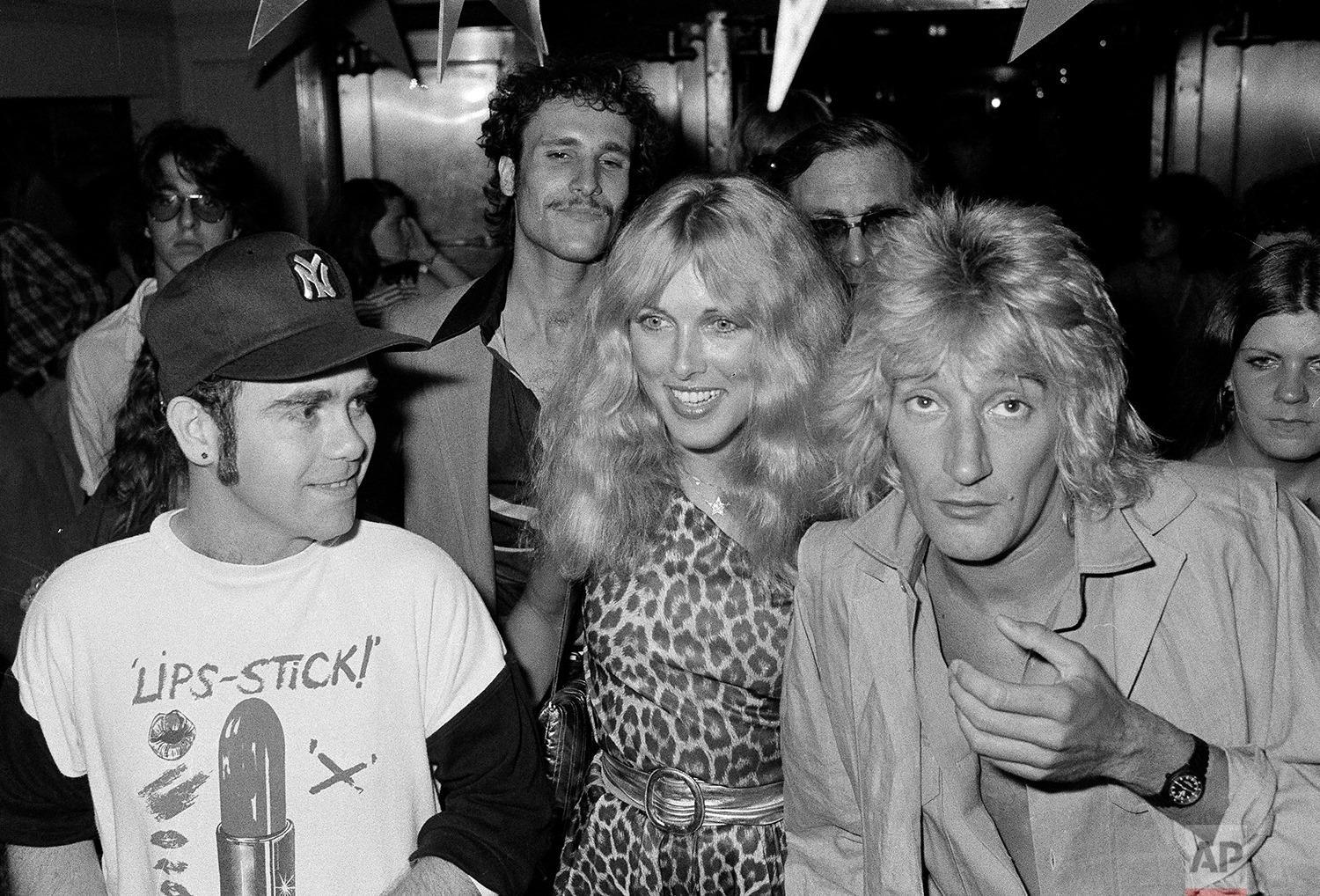 Elton John, Lana Hamilton and Rod Stewart arriving at New York's Studio 54 to celebrate John's ...