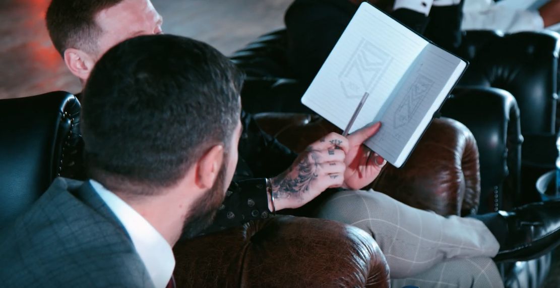 Ethan showing his drawing of his dad to Josh | Scrolller