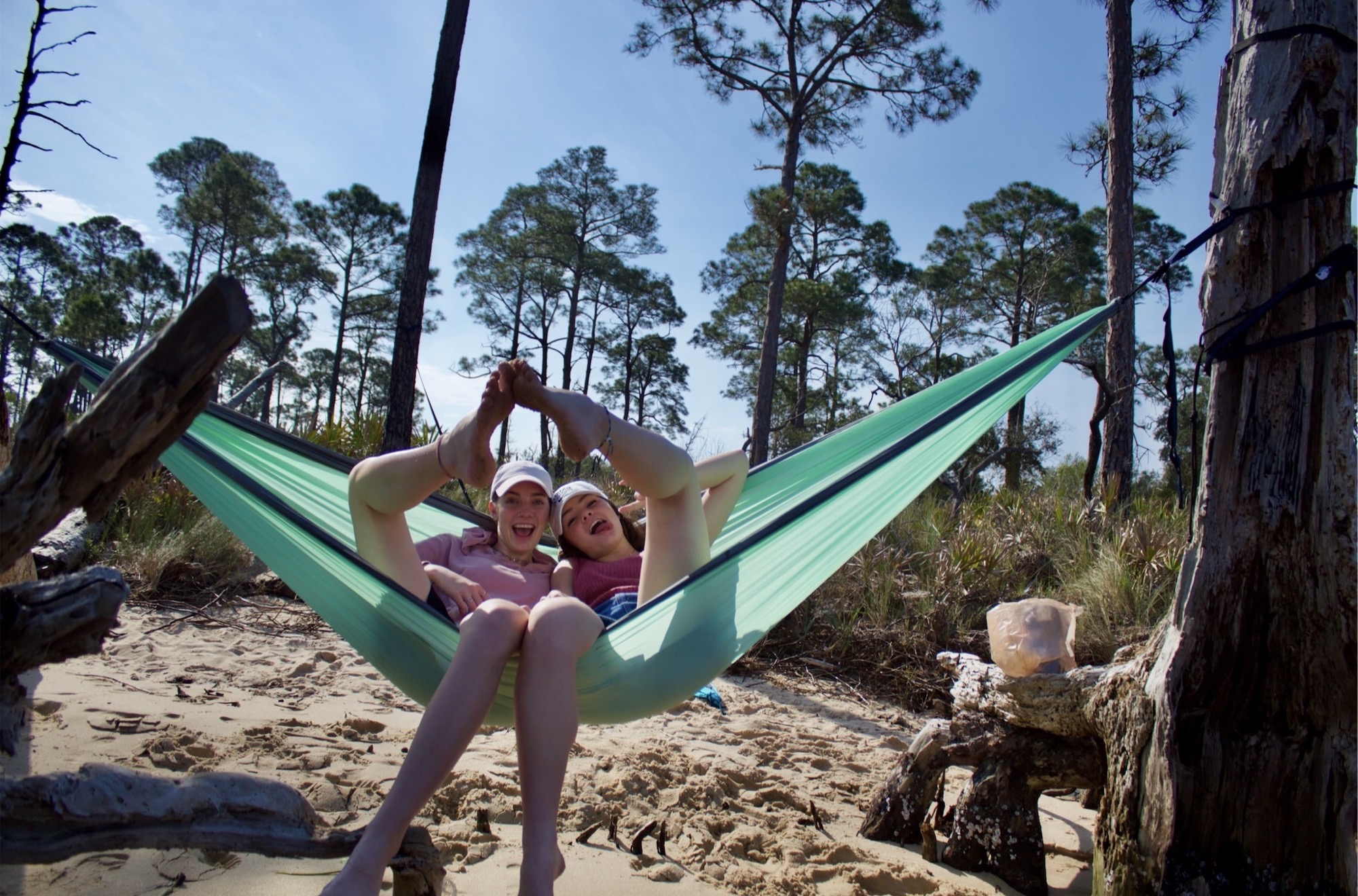 Feet in hammock touching | Scrolller
