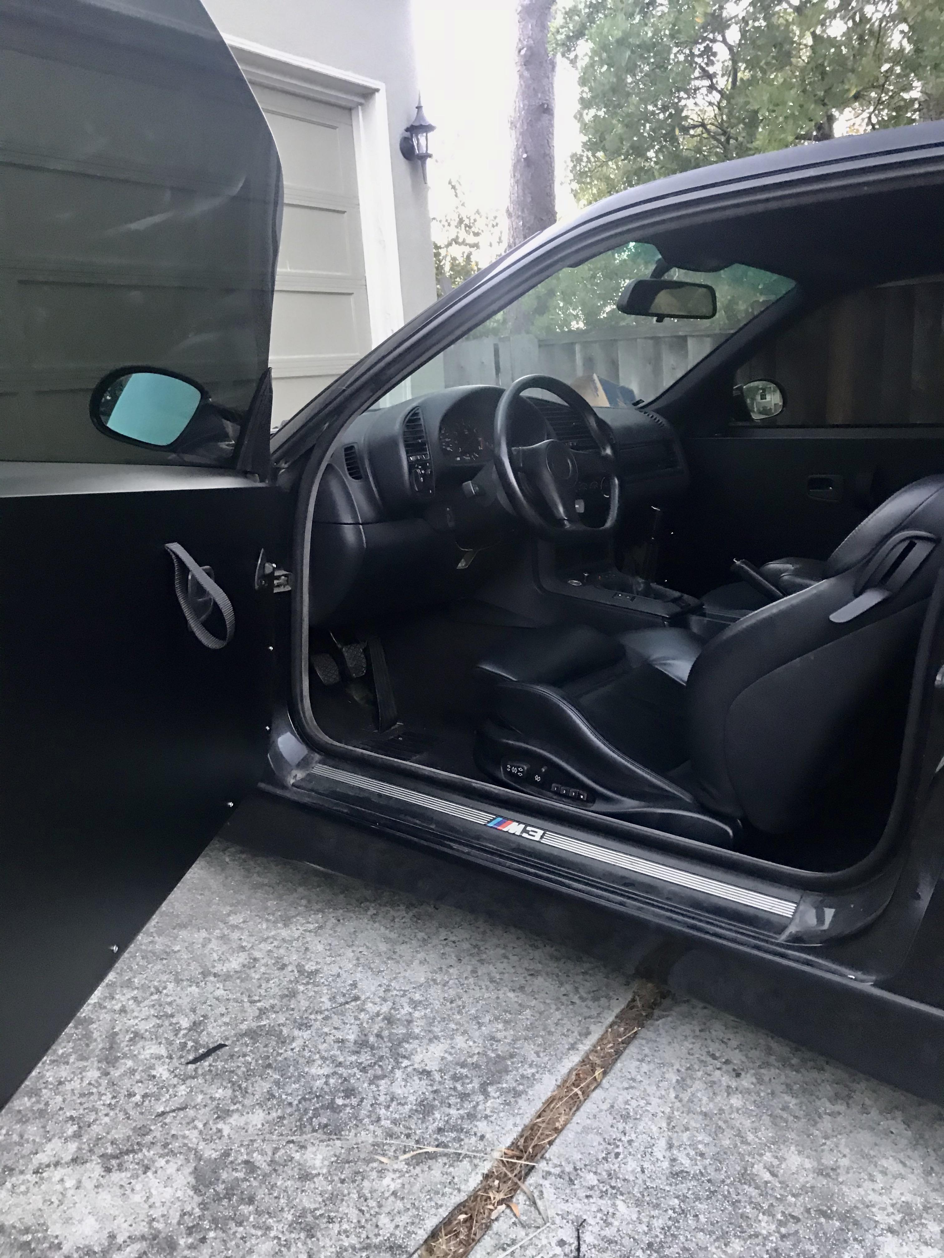 Finally completed my black interior swap. E46 m3 seats, nardi wheel ...