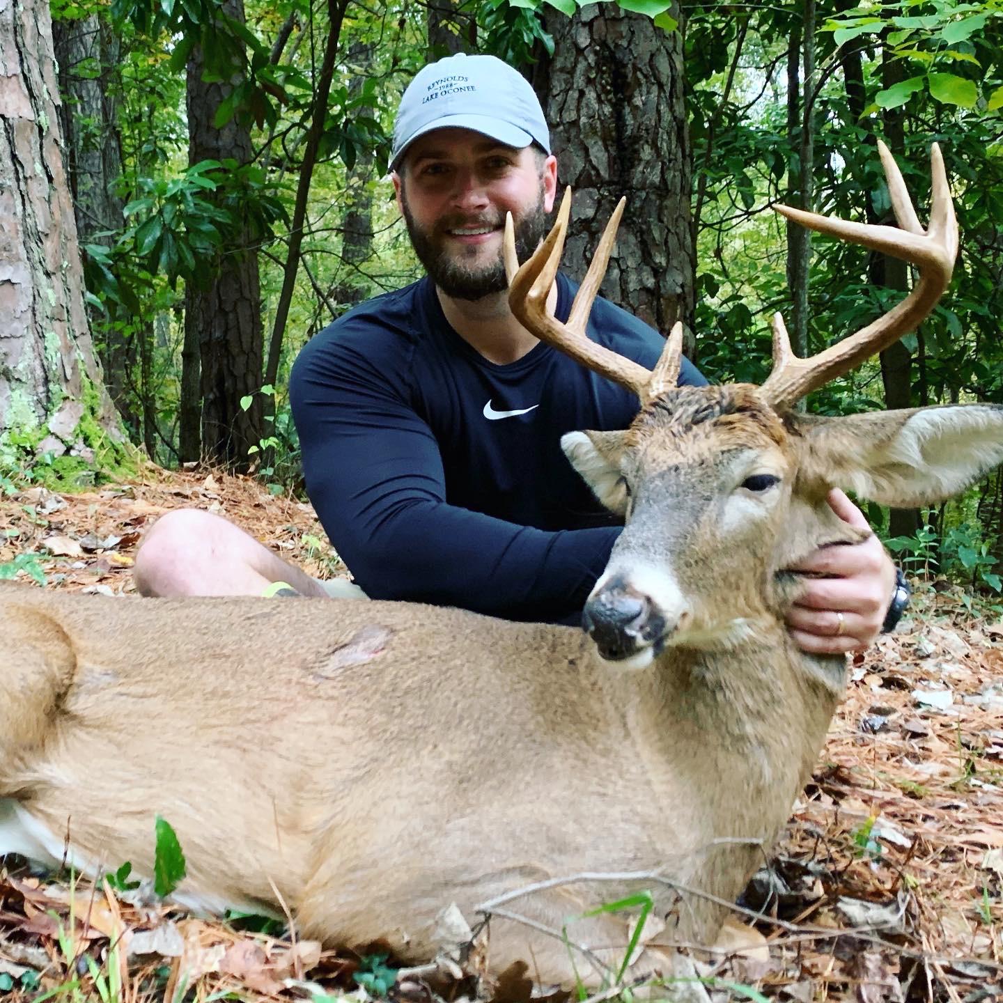 First buck ever, taken sitting indian style on the ground in the woods behind my backyard ...