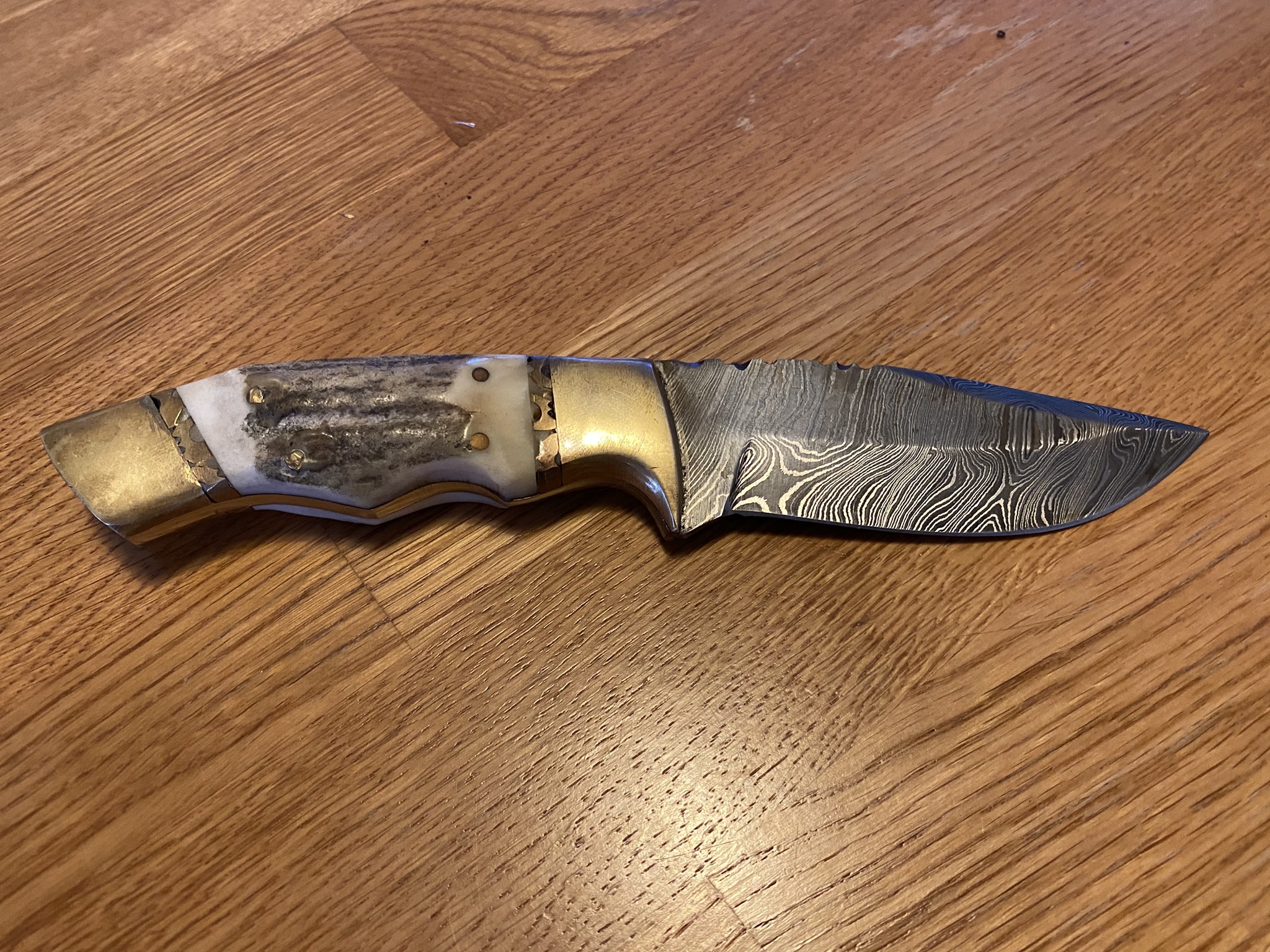 Flea Market Find - Damascus pattern with a staghorn and brass handle | Scrolller