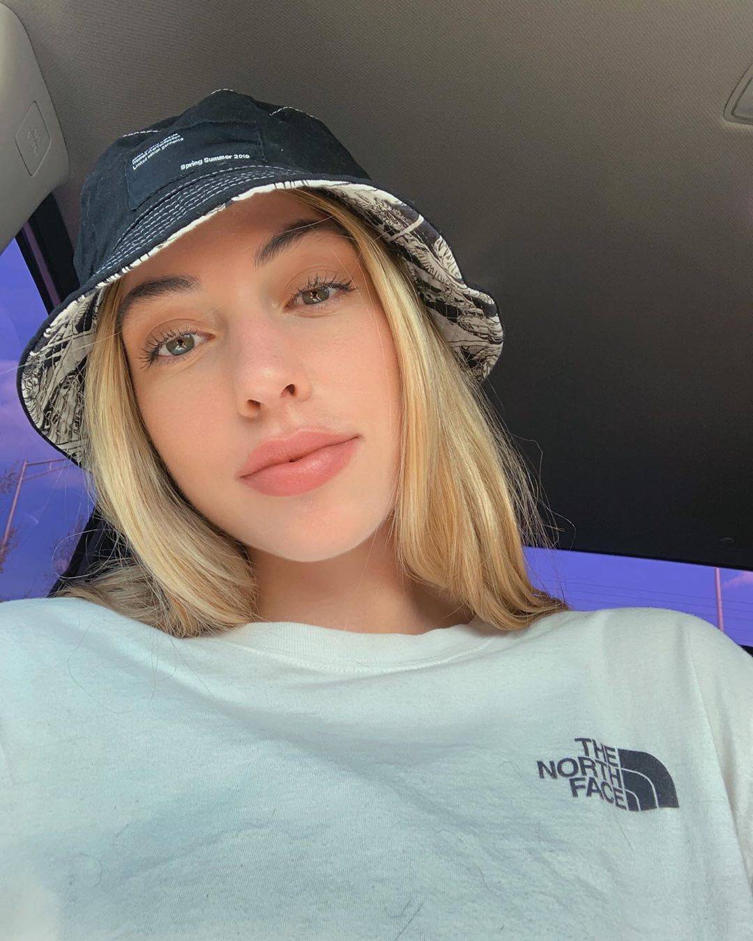 Full Pink Lips in a Bucket Hat | Scrolller