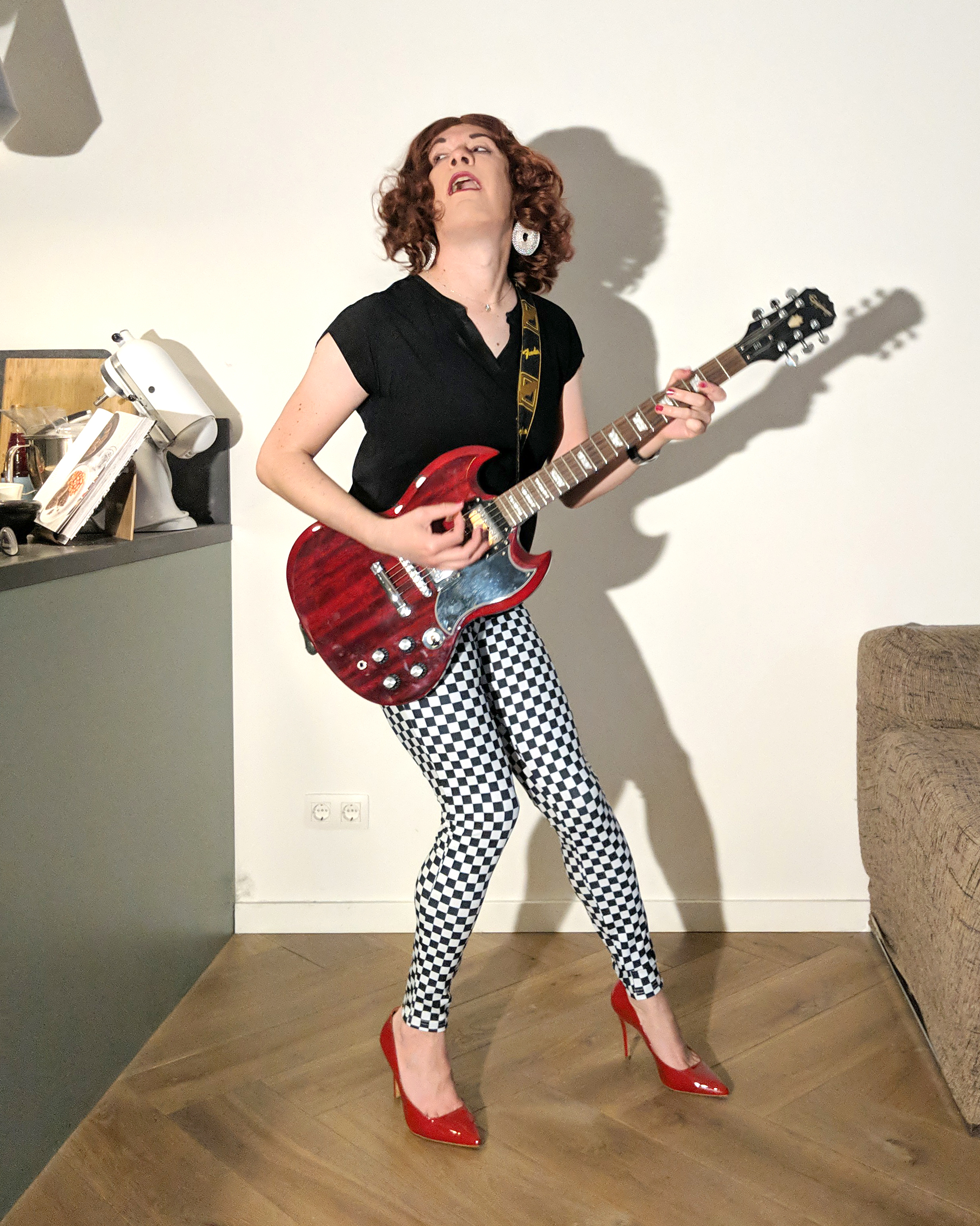 Guitar seems a much more masculine pastime when it's electric. Well, if it helps: it's not ...