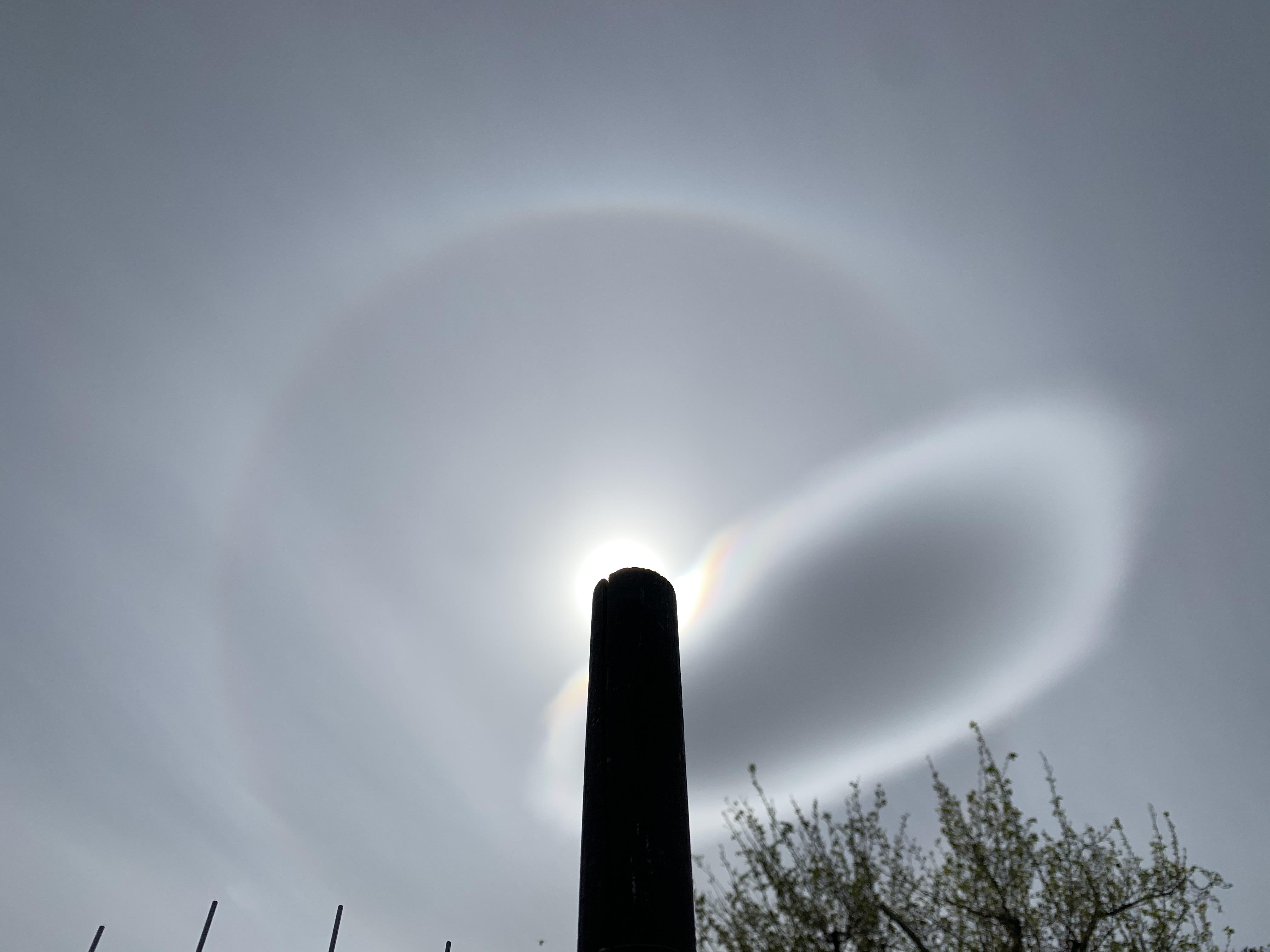Halo over Las Vegas today with an oval cloud fringed with iridescence | Scrolller