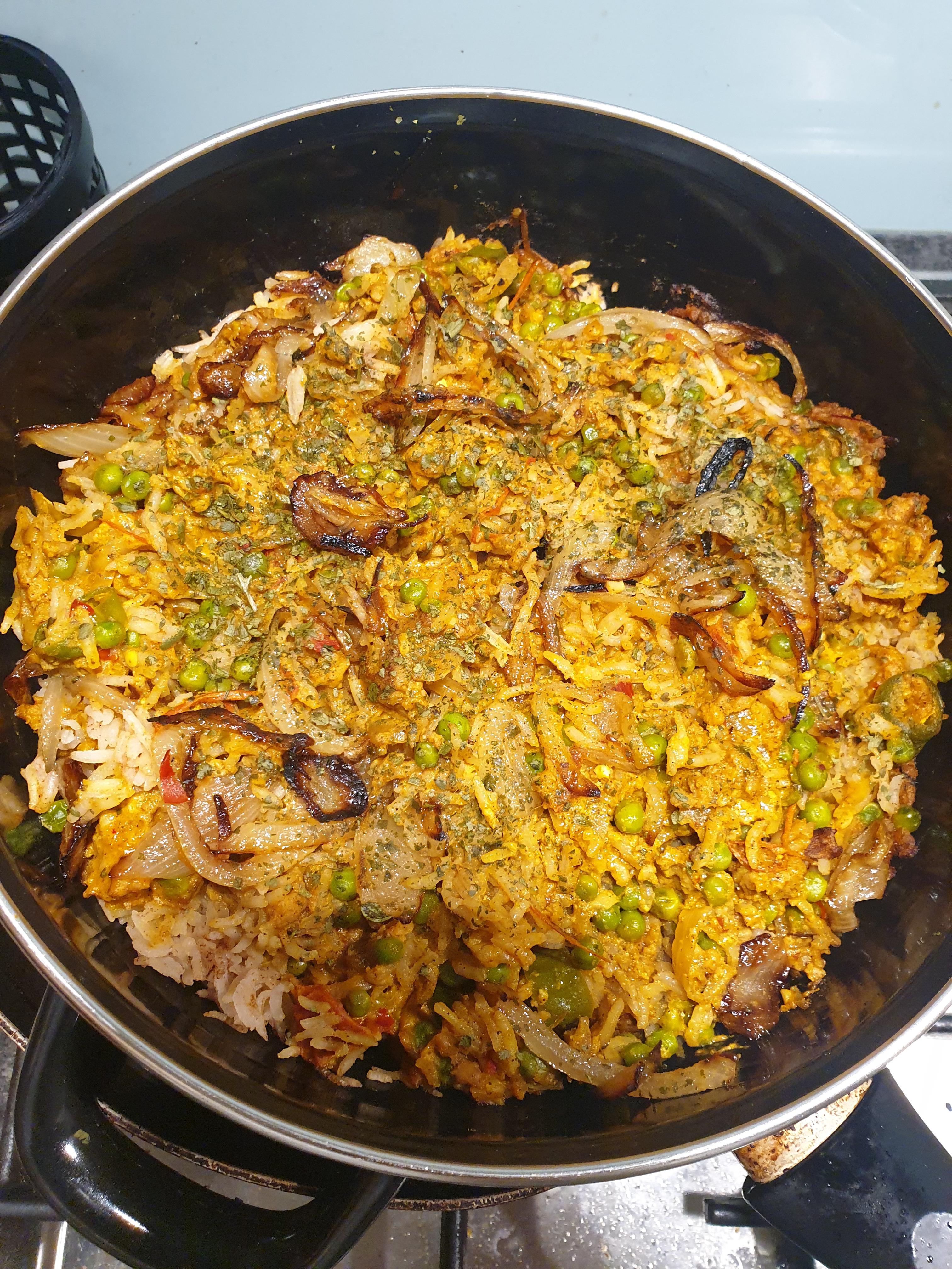 Home made biriyani - indian spiced rice with minced chicken , fried onions, tomtoes , a million ...