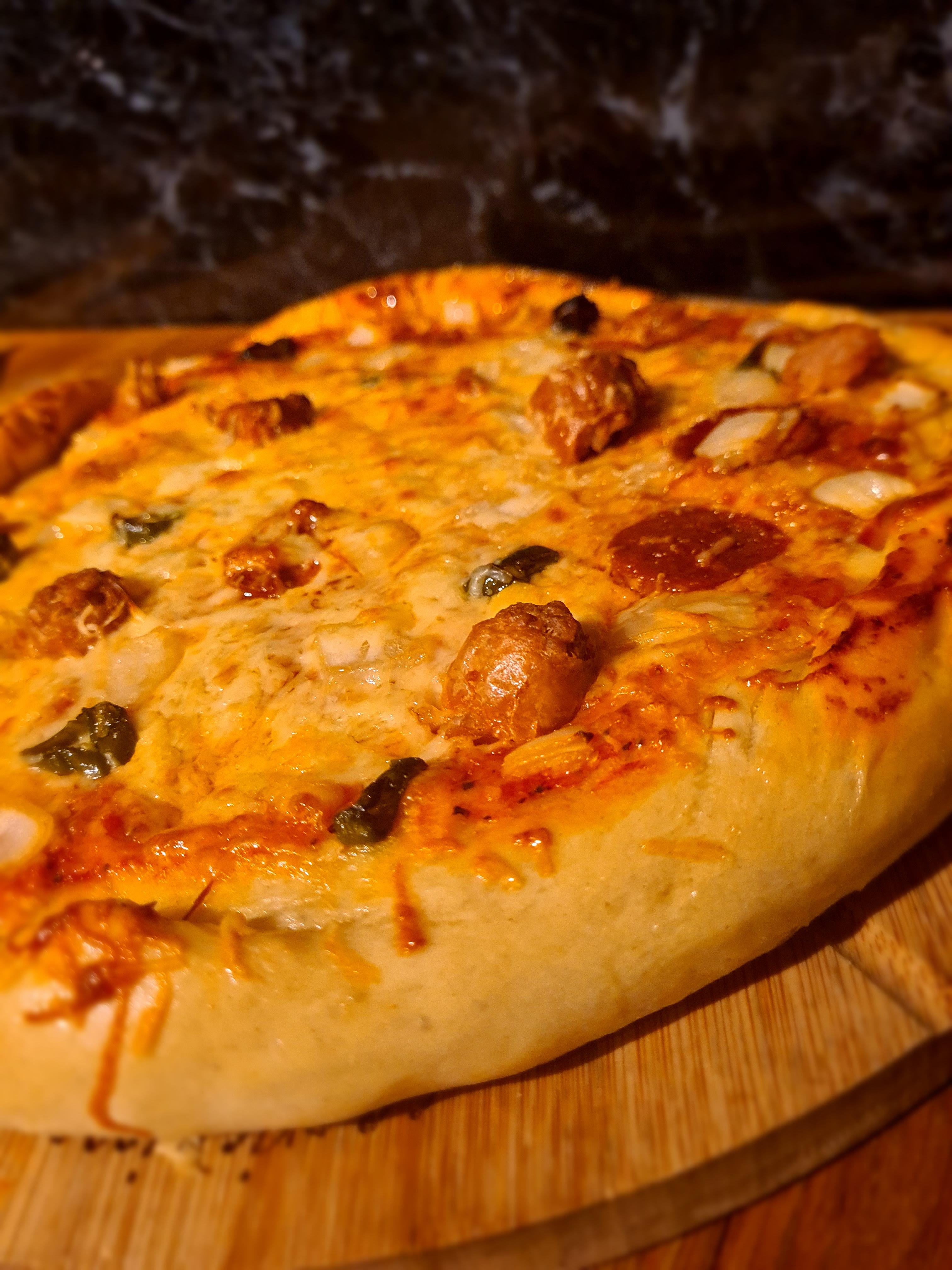 Homemade stuffed crust pizza with sausage, chorizo, onion, jalapeño and extra cheese | Scrolller