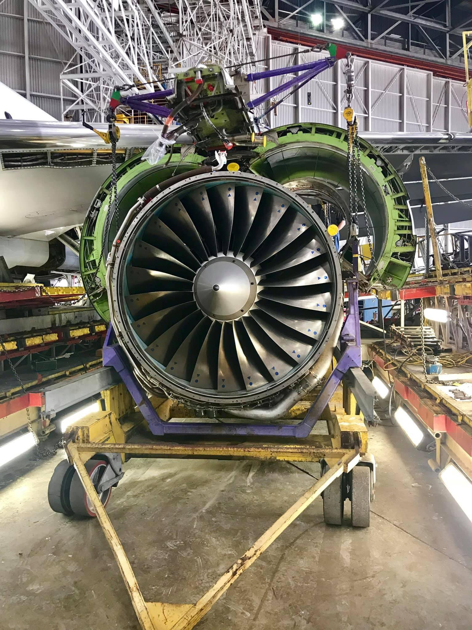 Installing an engine onto an aircraft. | Scrolller