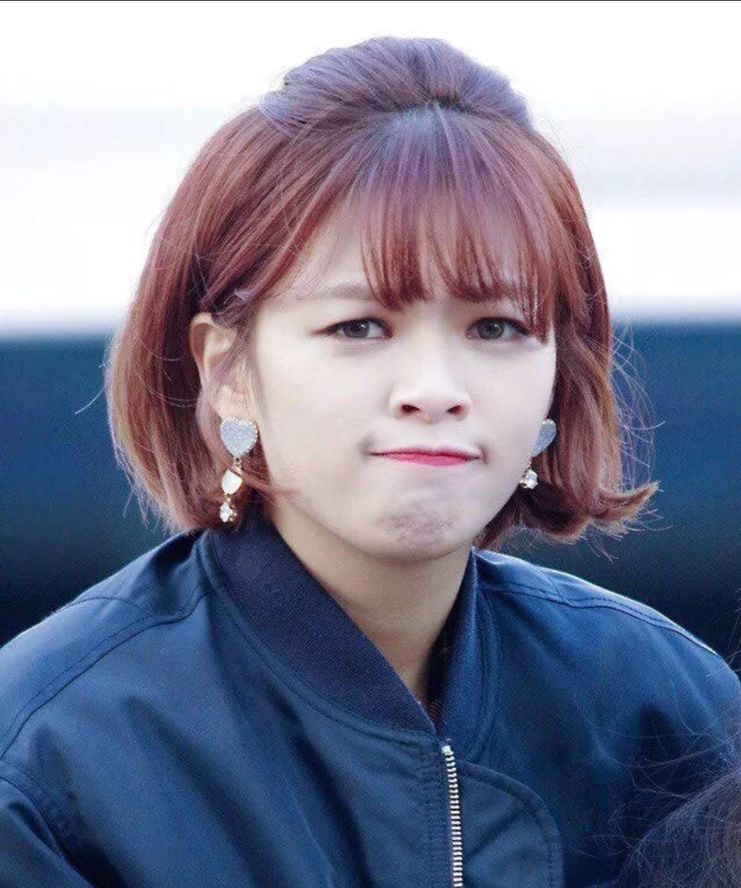 Jeongyeon - red hair, black jacket | Scrolller