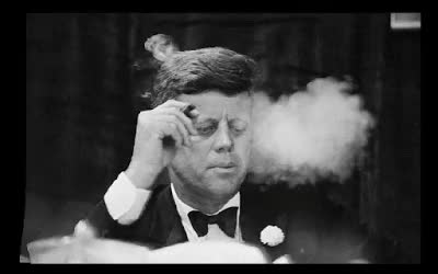 JFK smoking a cigar | Scrolller