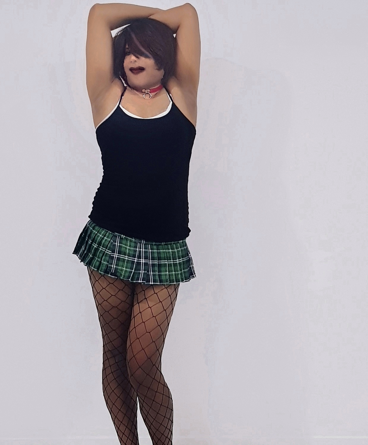 Just a cheeky pose in my new fishnets and plaid skirt :) | Scrolller