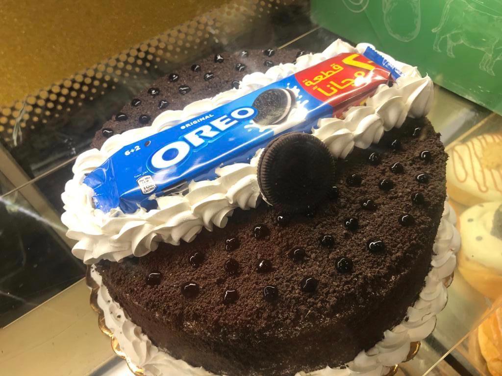 Oreo cake with a pack of Oreo on top | Scrolller