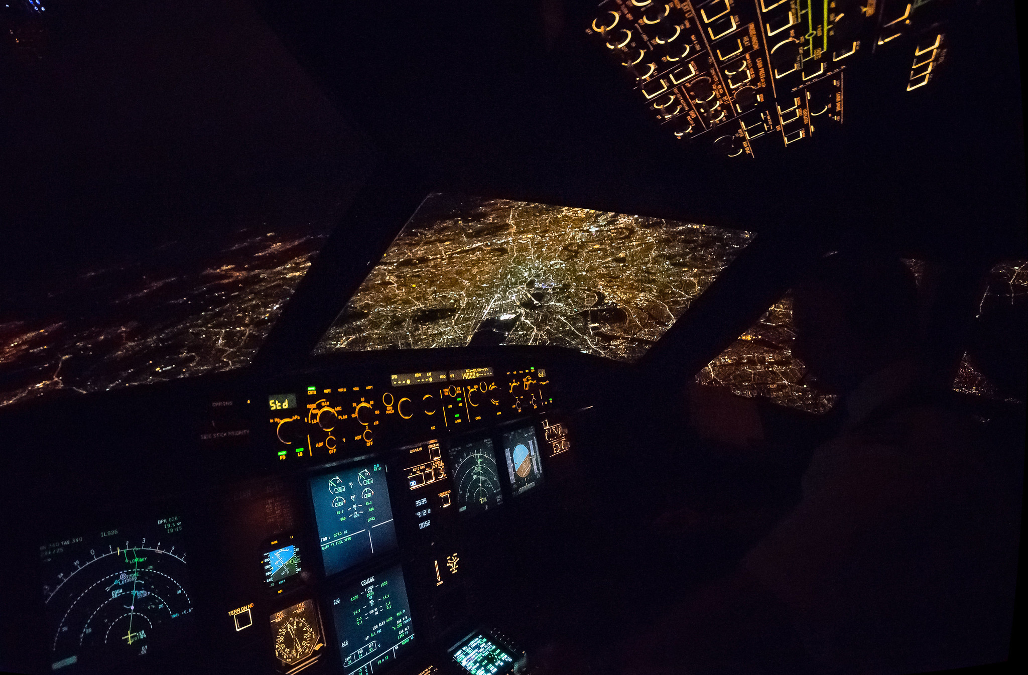 Looking out the cockpit at London at night. | Scrolller