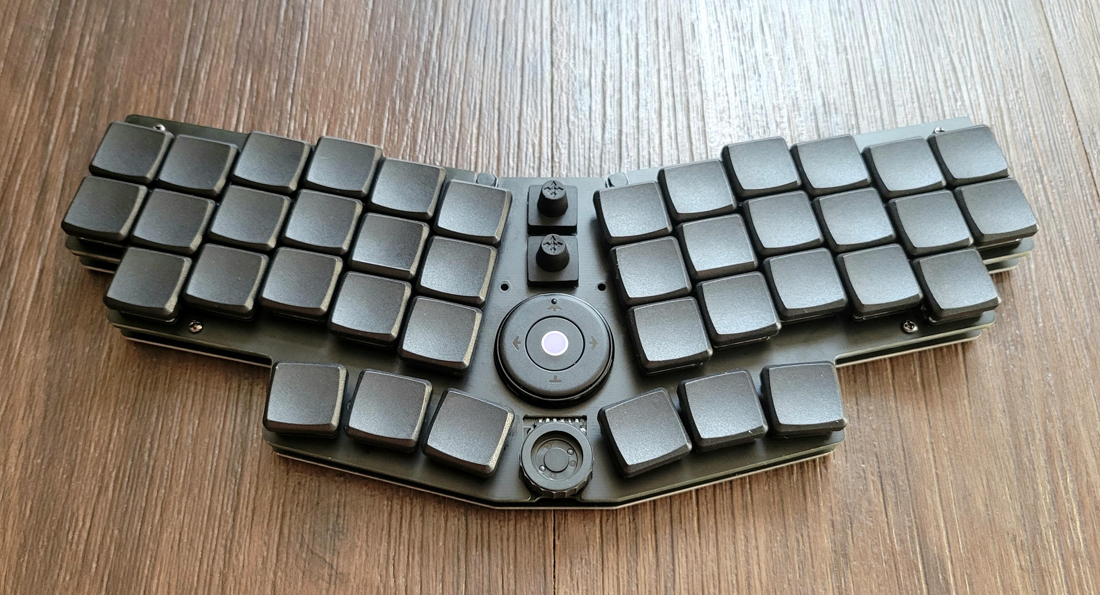 Made Peregrine, a wireless ergonomic board with a built in trackpad module that can be removed ...