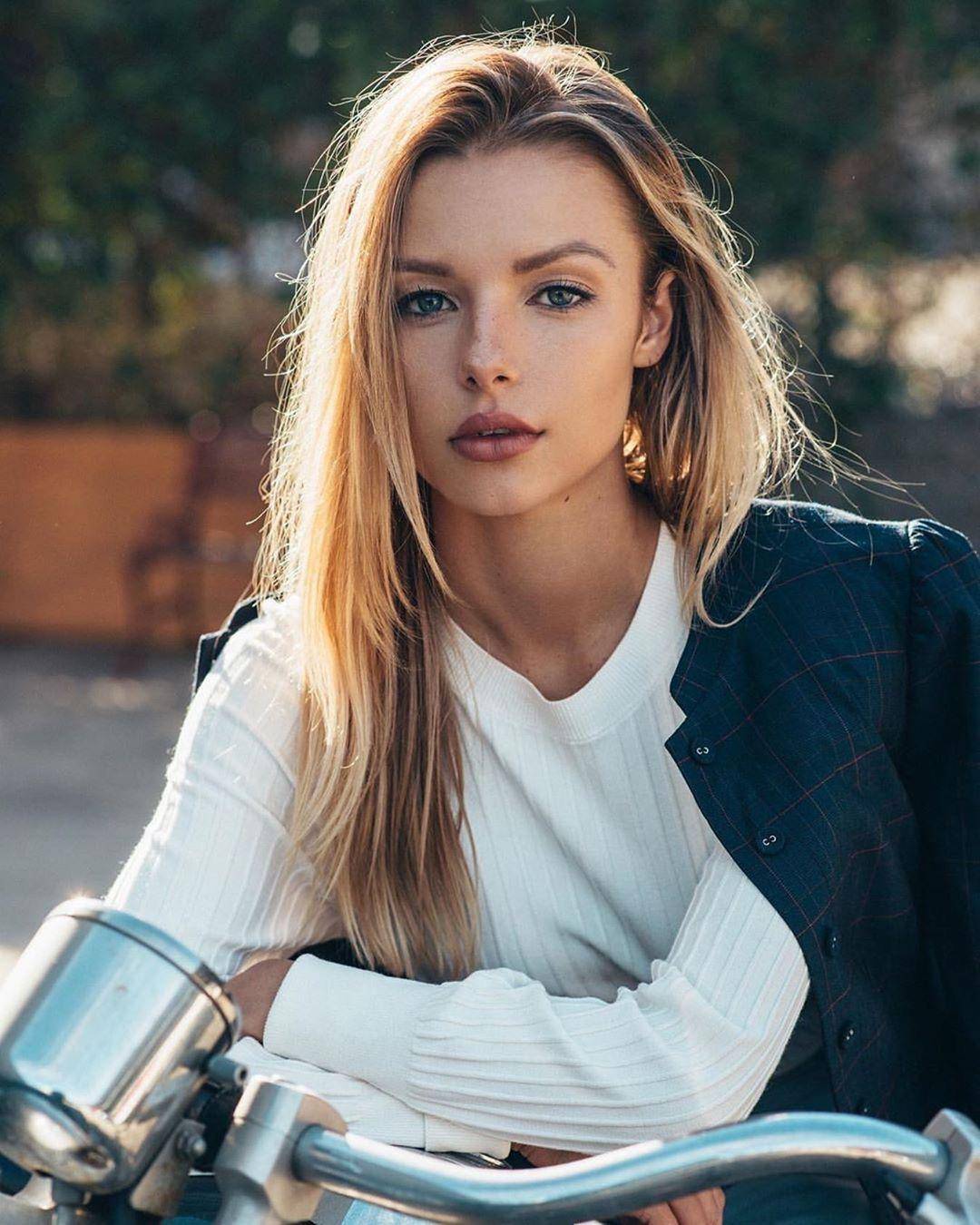 Madi Teeuws - White Sweater and Blue Jacket | Scrolller