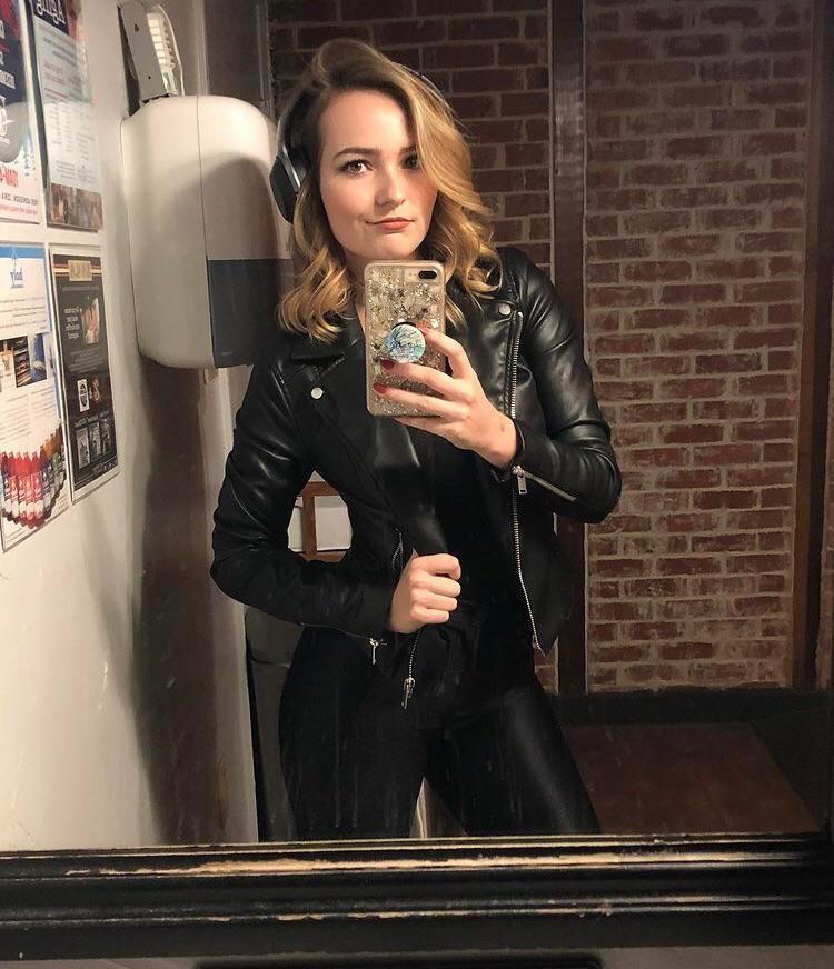 Maggie in a leather jacket | Scrolller