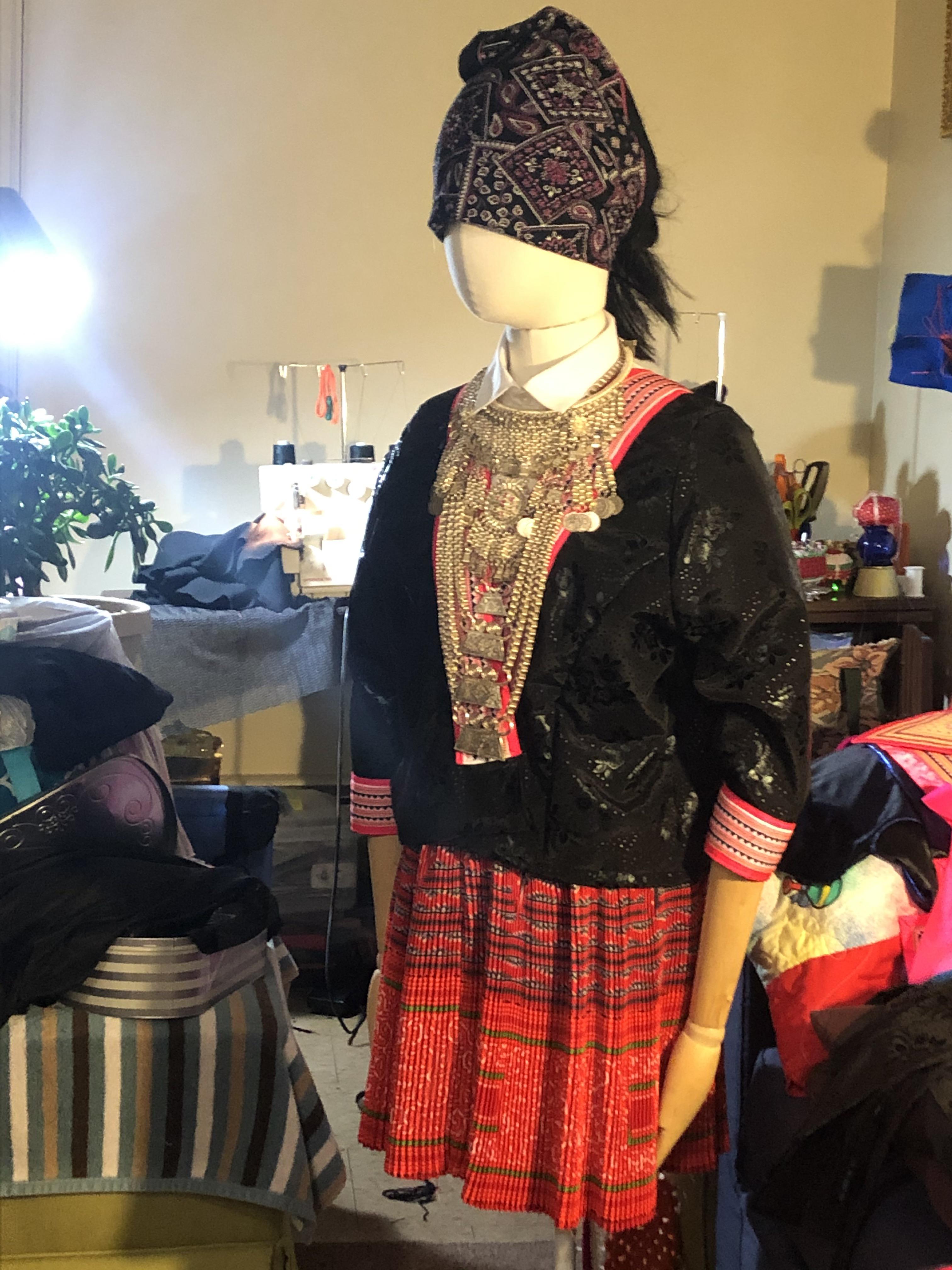 Mama sewing traditional Hmong clothing | Scrolller