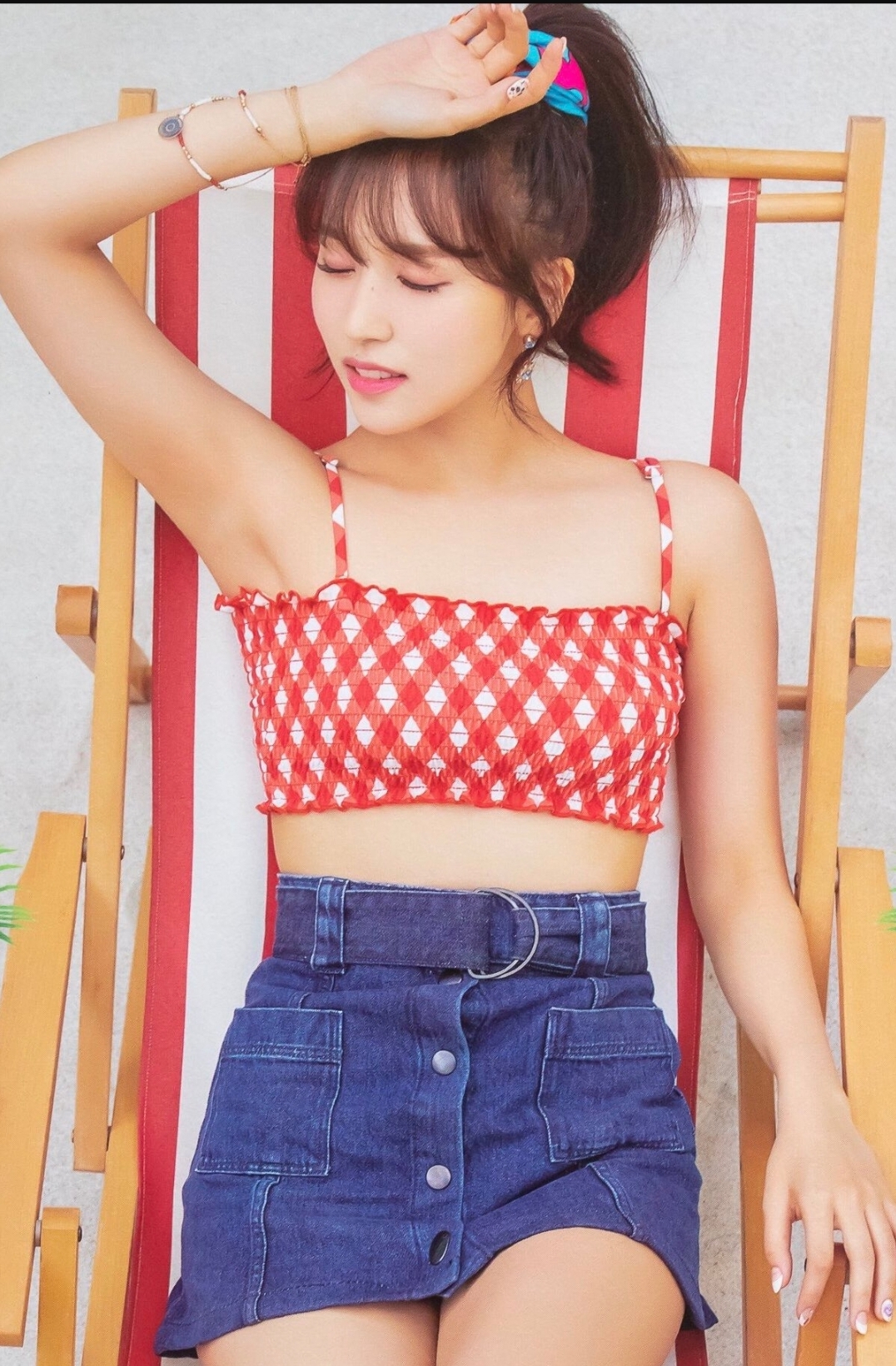 Mina - jean skirt, red checkered top, beach chair | Scrolller