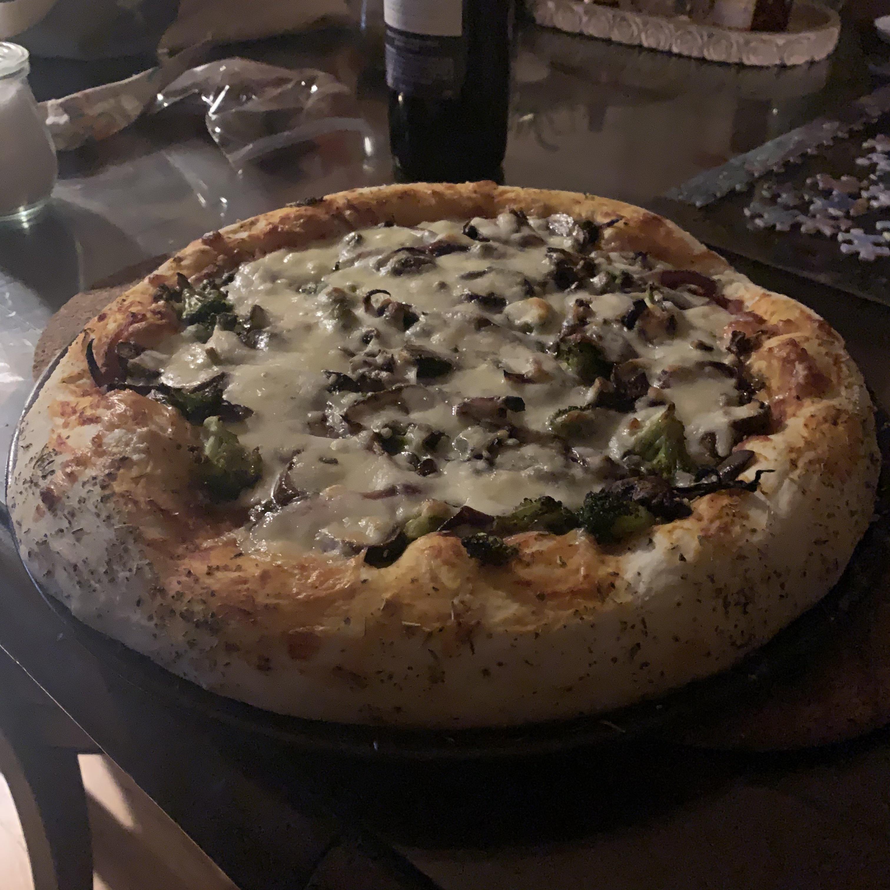 Mushrooms, broccoli, red onion, bleu cheese, mozzarella. | Scrolller