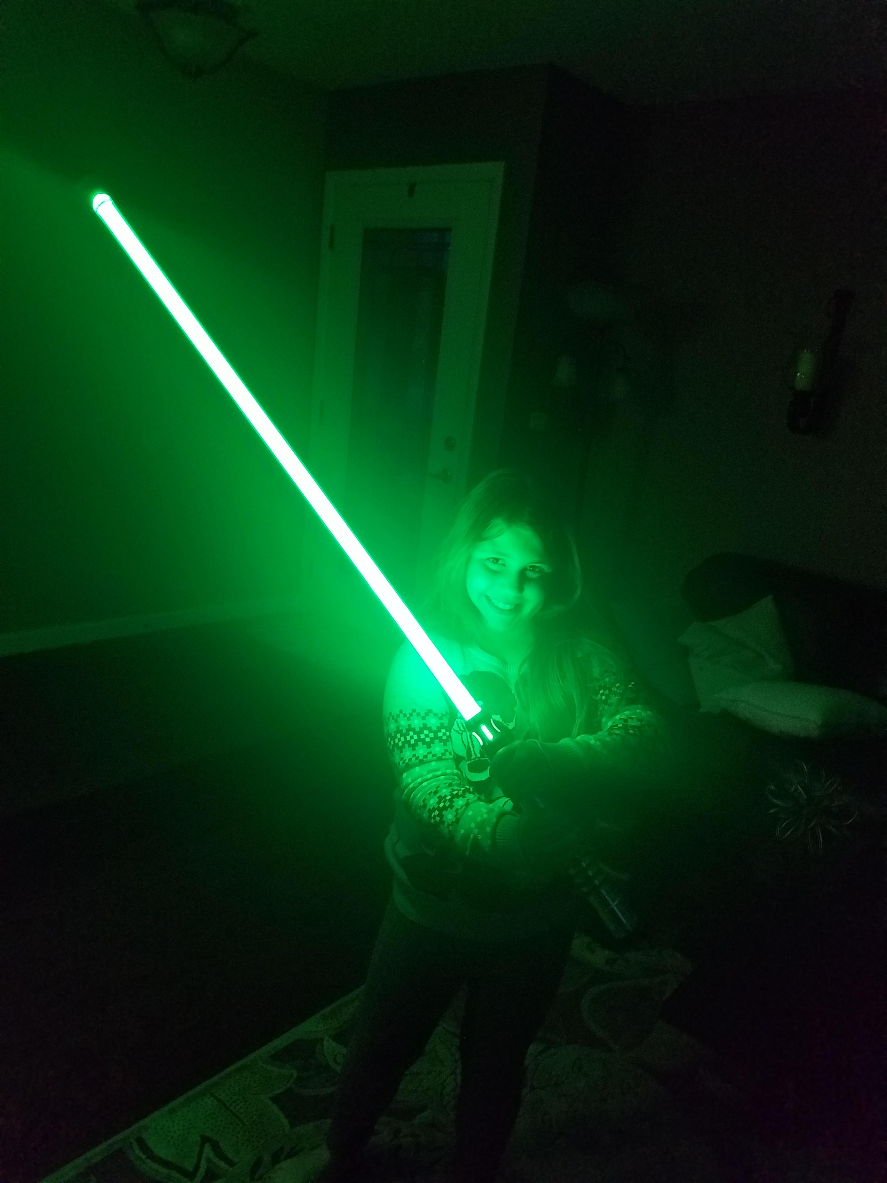 My daughter with a light saber | Scrolller
