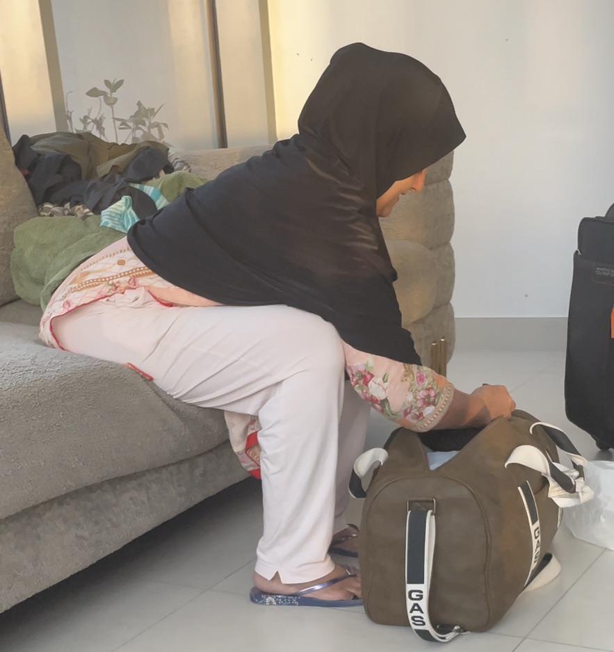 My hijabi mom packing bags for my dad. So we that we can have some fun. | Scrolller