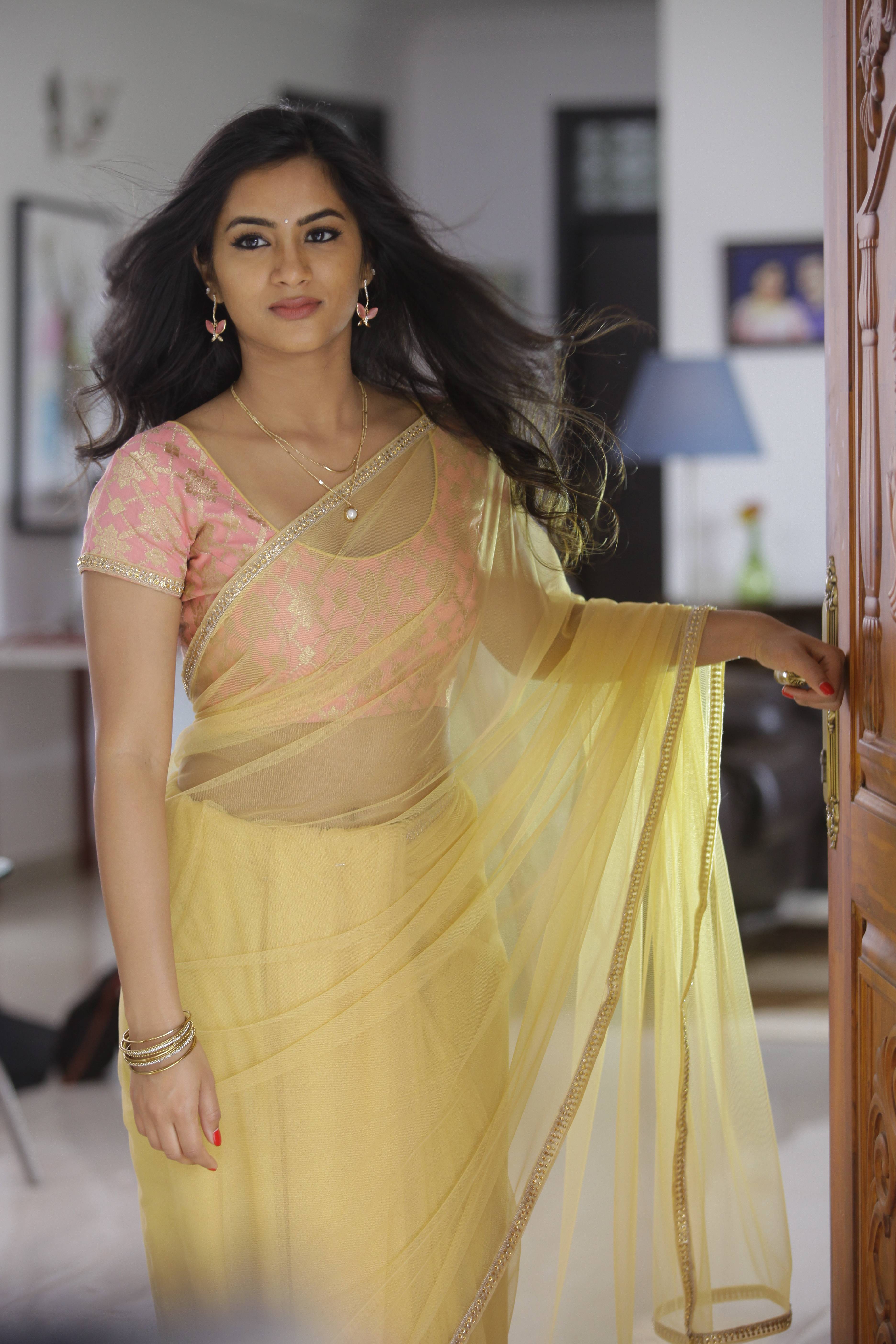 Neha Krishna Navel In Yellow Transparent Saree Scrolller