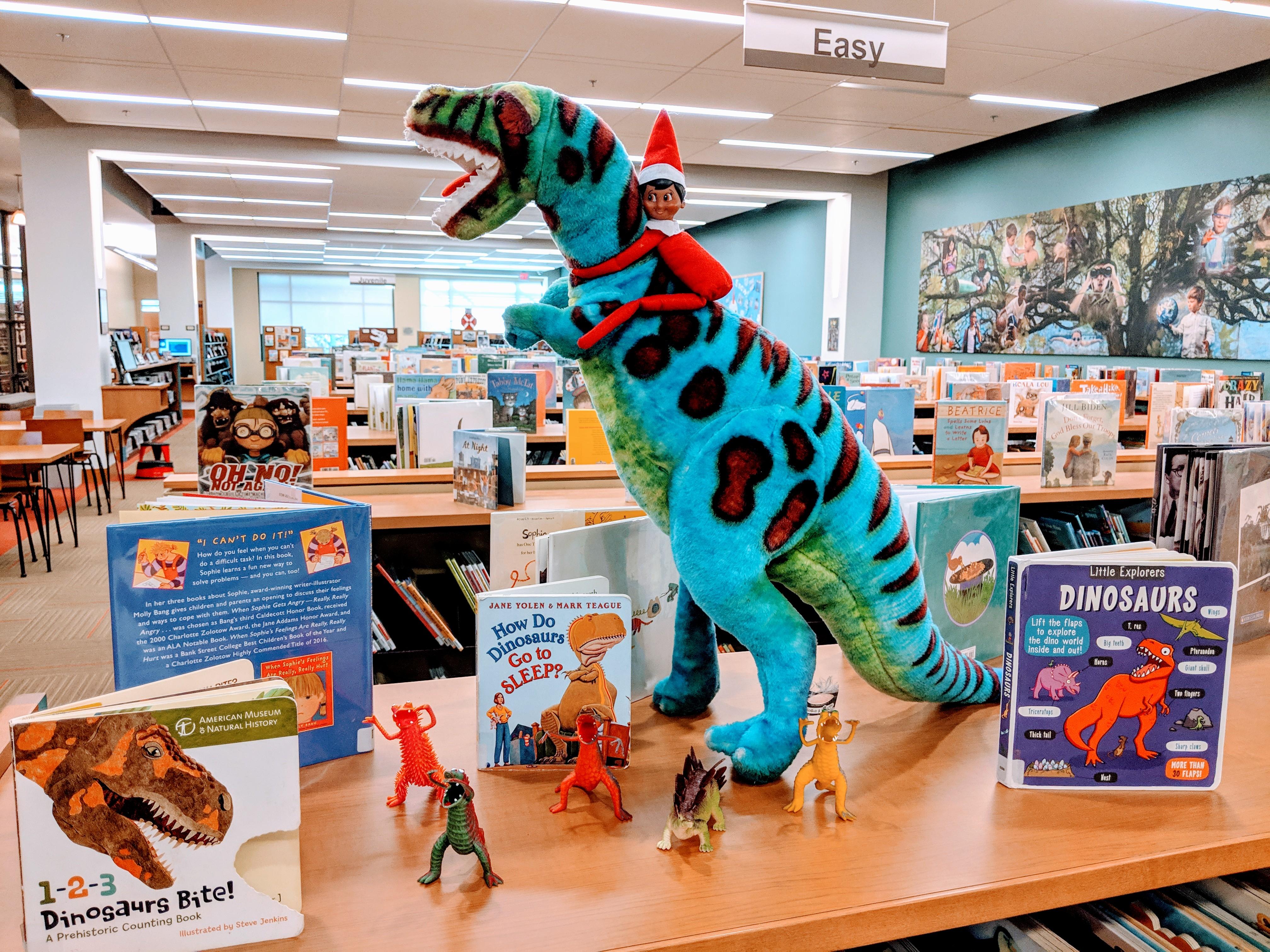 Our library elf Jingles...T-Rex tamer!! | Scrolller