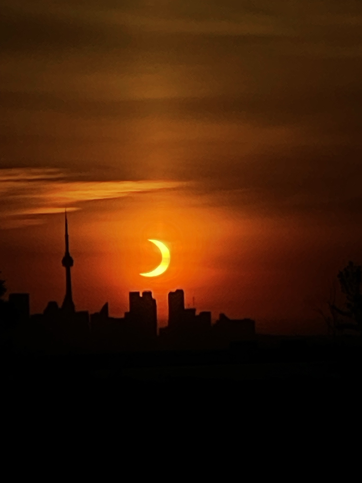 Partial Eclipse over Downtown From This Morning | Scrolller