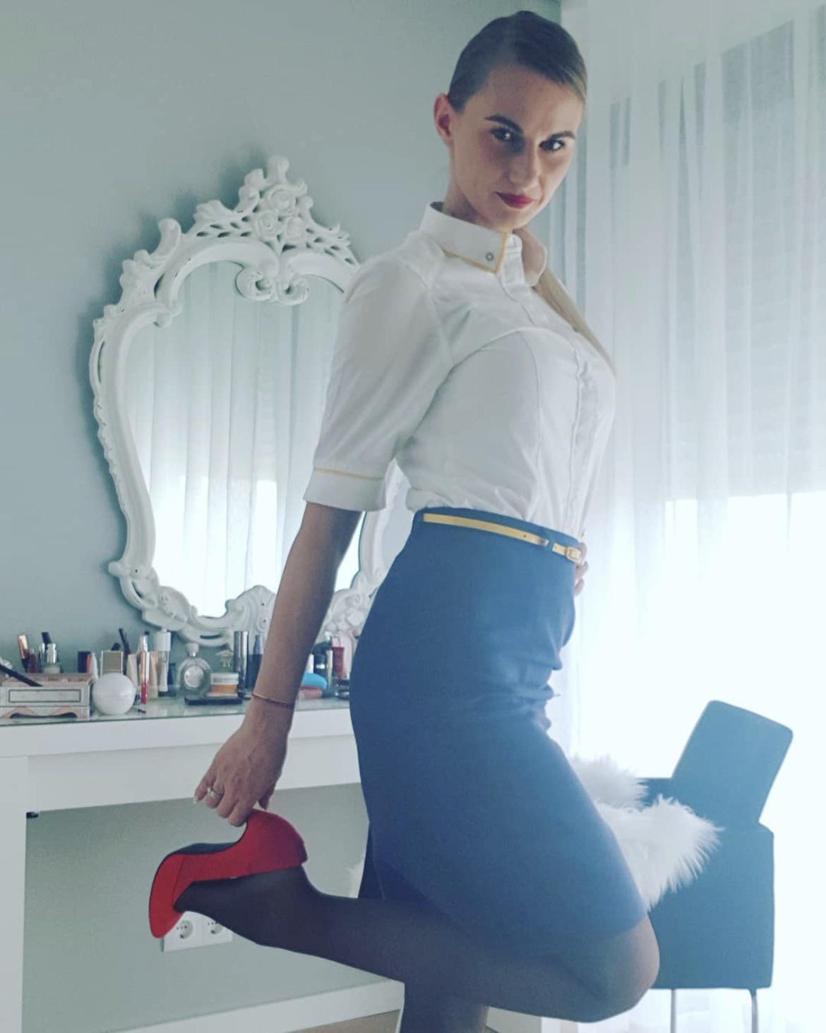 Red heels under blue uniform? | Scrolller