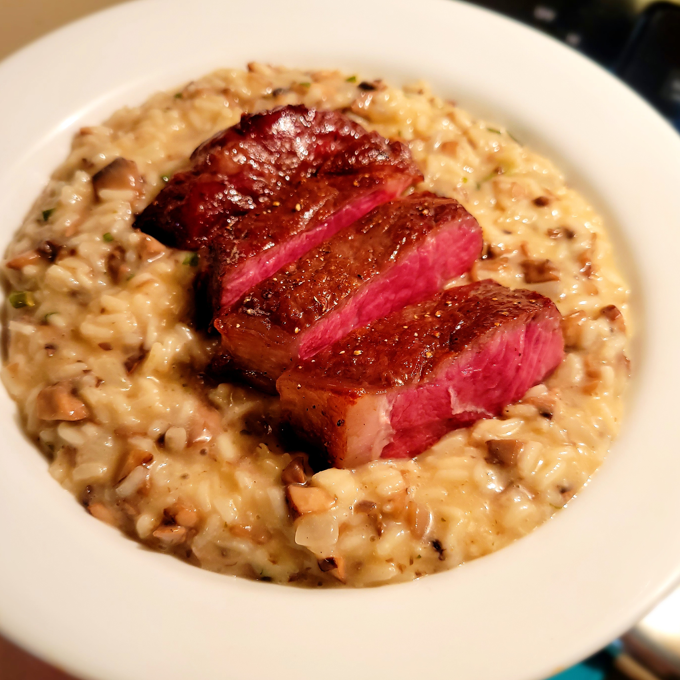 Reverse seared strip steak and mushroom risotto | Scrolller