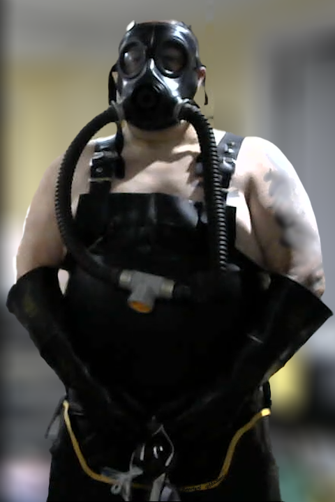 Rubber gimp in cage | Scrolller