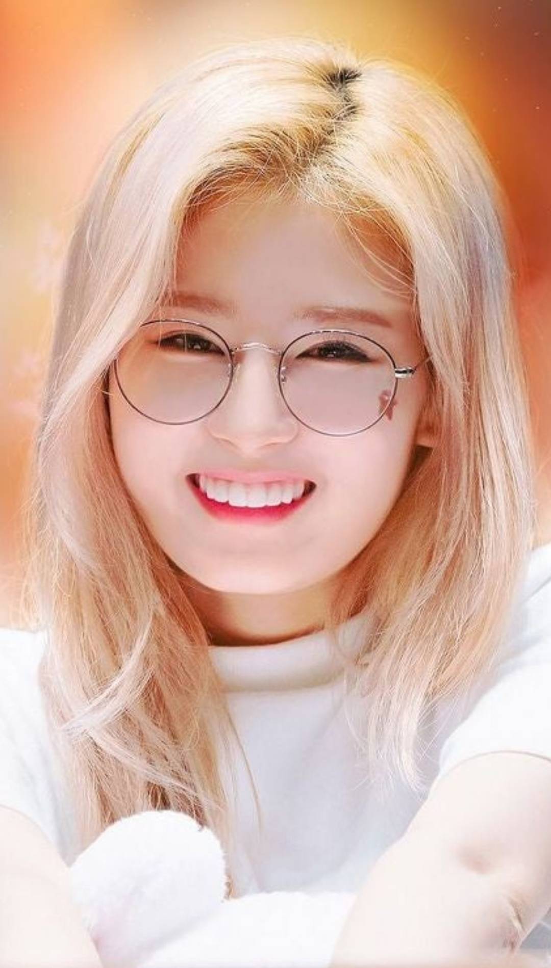 Sana - blonde, glasses, close up | Scrolller