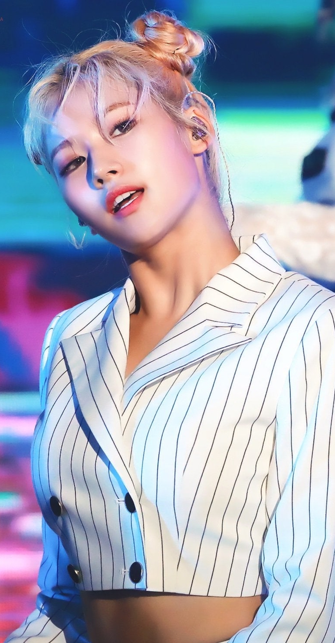 Sana - blonde hair buns, white striped suit jacket | Scrolller