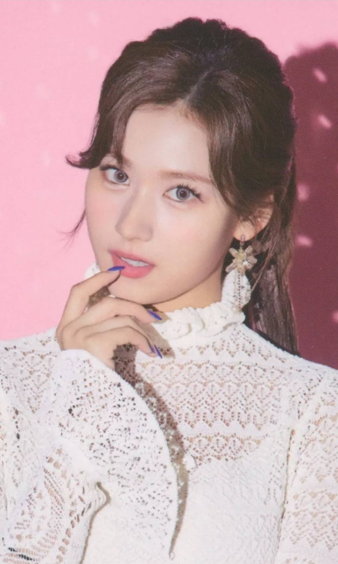 Sana - light eyes, white sweater | Scrolller