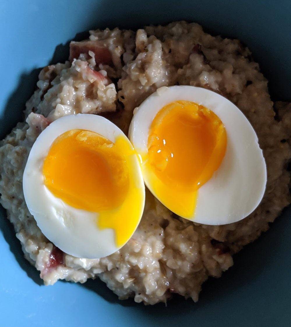 Savory oatmeal (chopped cooked bacon and goat Brie) with a soft boiled egg. | Scrolller